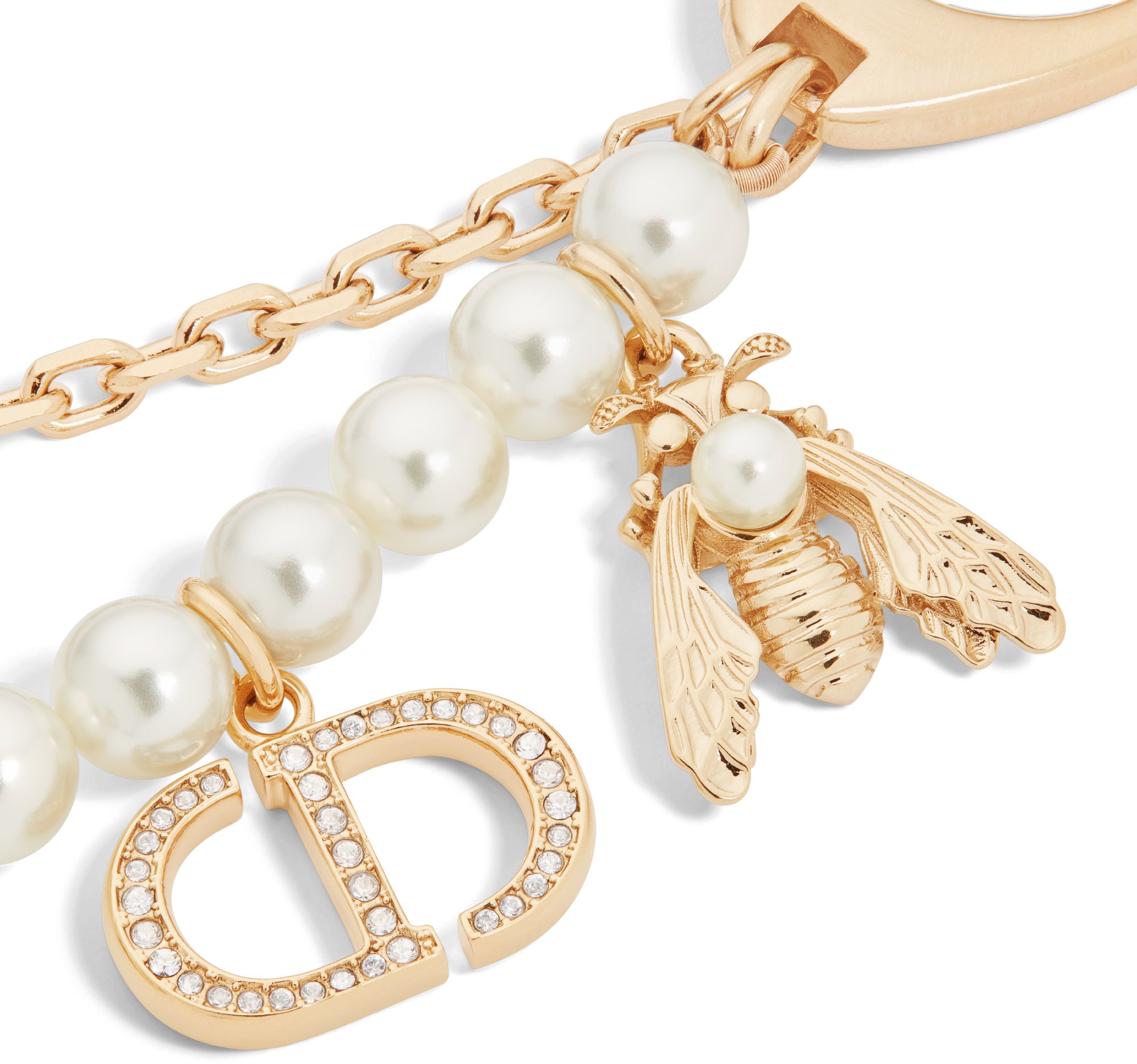 Bijou de sac Petit CD Métal finition doré pâle, perles en résine blanche, cristaux argentés et ...